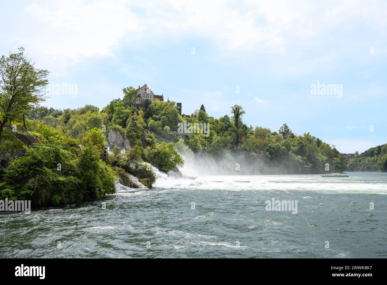 Description: Tourists experiencing the massive waterfalls below Laufen ...
