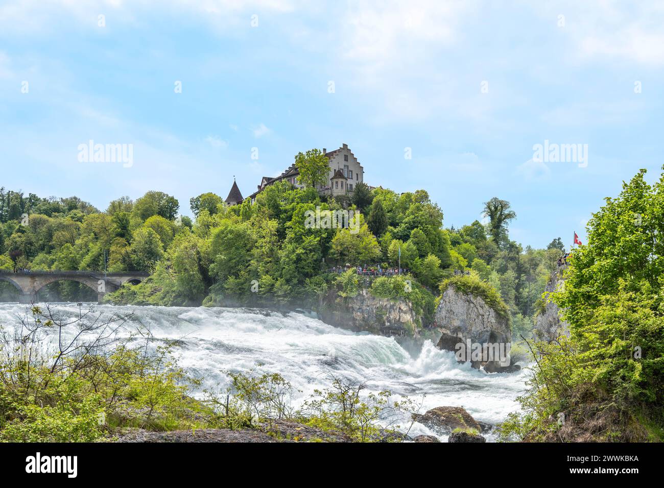 Description: Tourists experience the massive waterfalls below Laufen Castle at the Rhine Falls ...