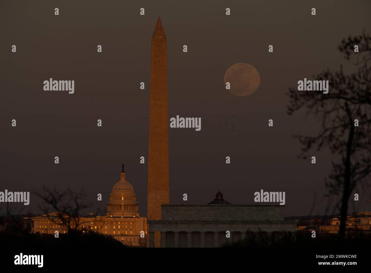 The Worm moon rises over the US Capitol and the Washington Monument ...