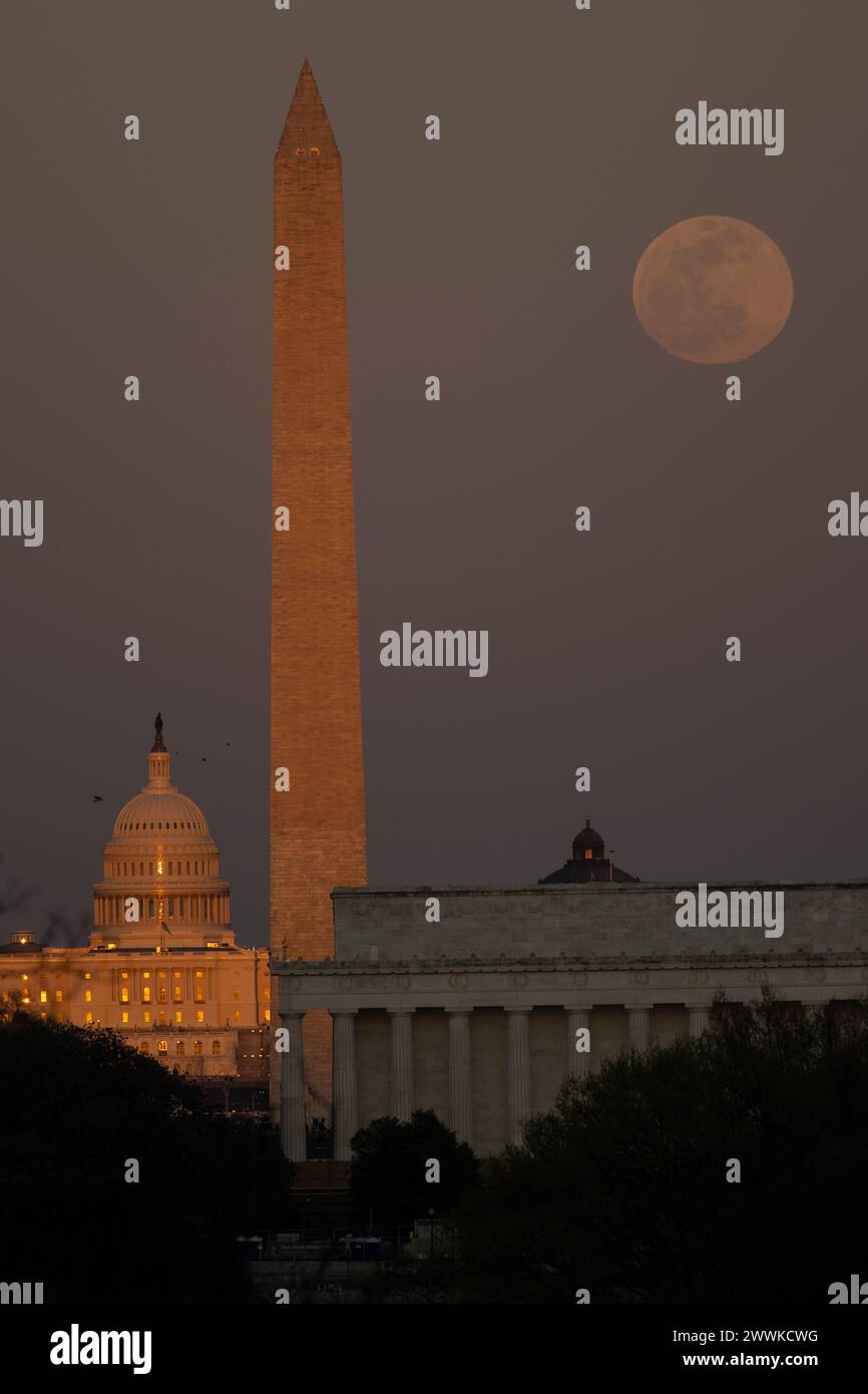 The Worm moon rises over the US Capitol and the Washington Monument ...
