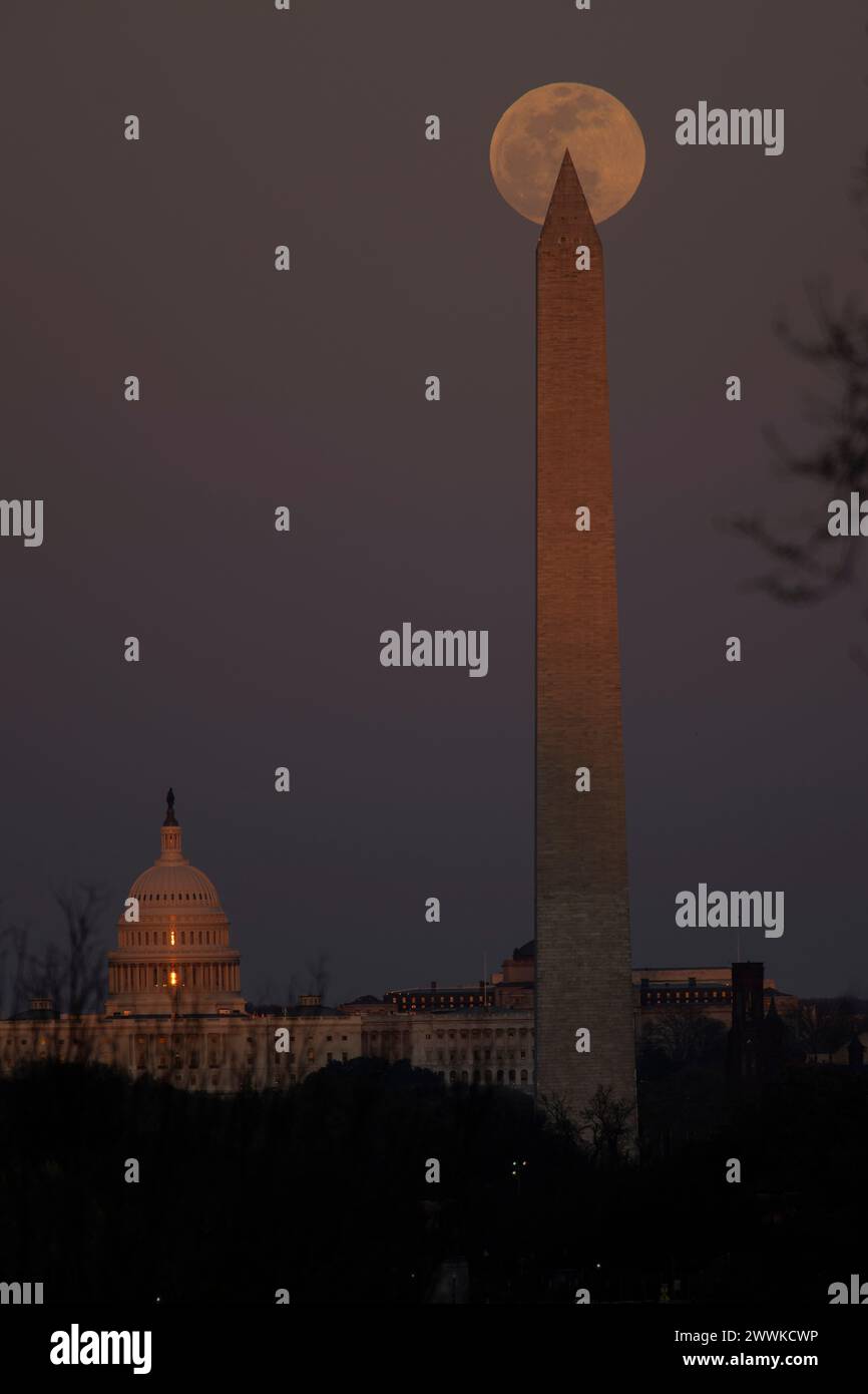 The Worm moon rises over the US Capitol and the Washington Monument ...
