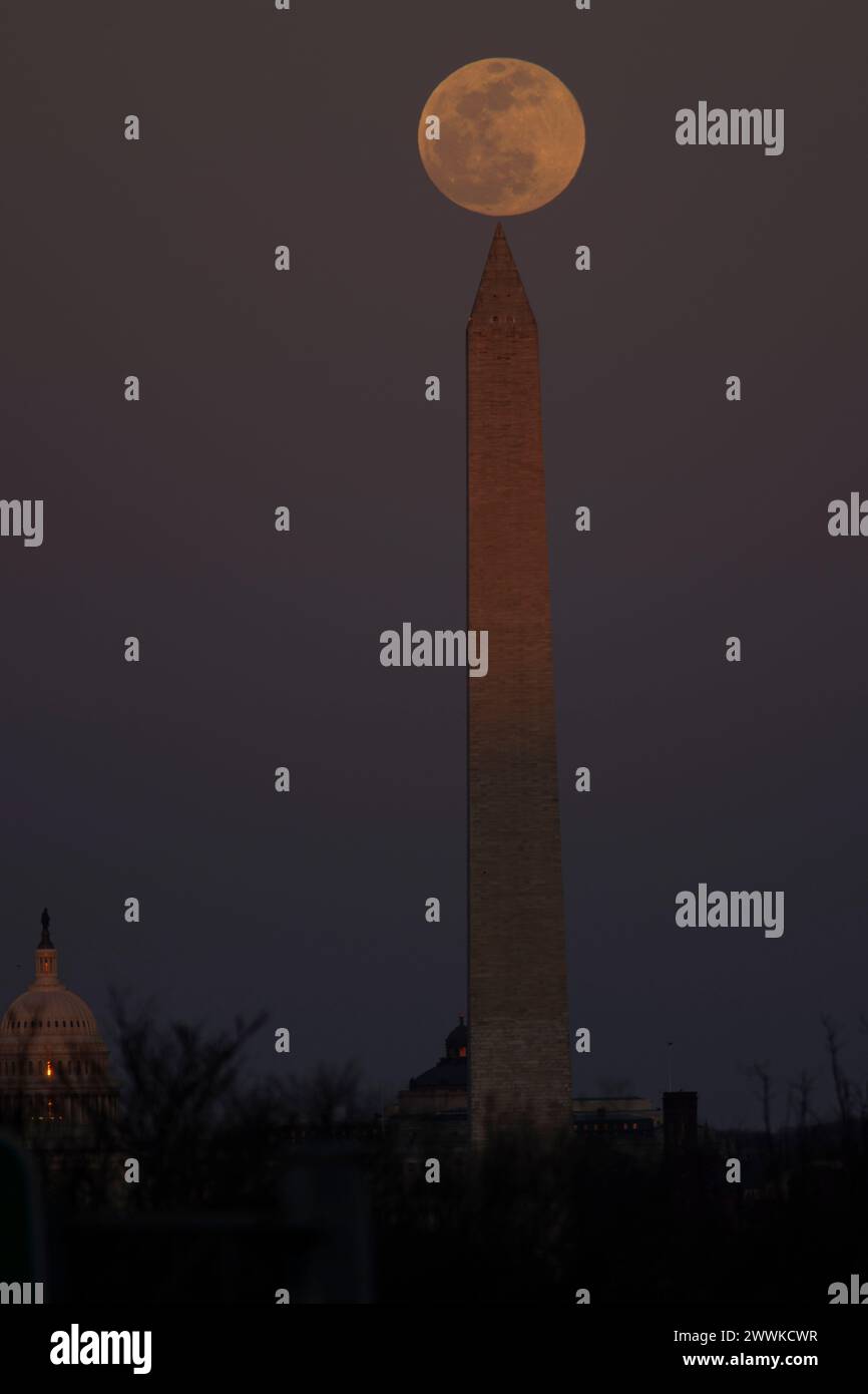 The Worm moon rises over the US Capitol and the Washington Monument ...