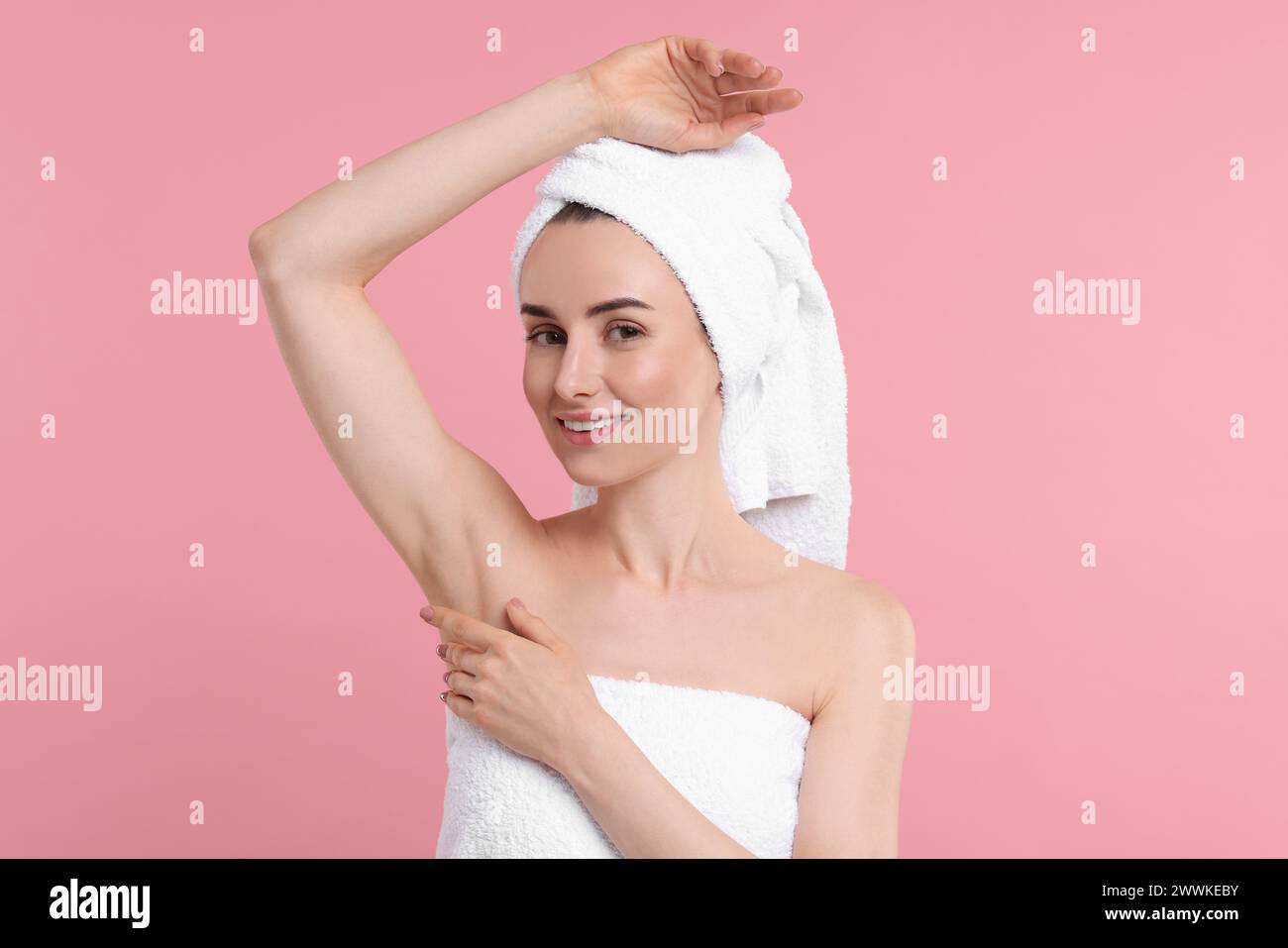 Beautiful woman showing armpit with smooth clean skin on pink ...