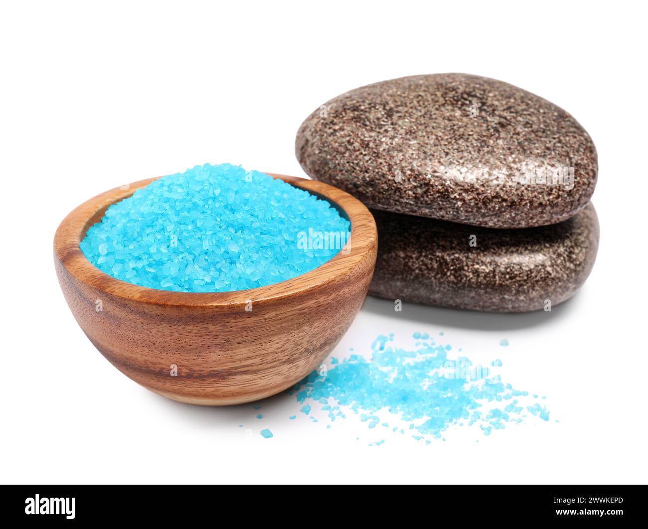 Light blue sea salt in bowl and spa stones isolated on white Stock ...