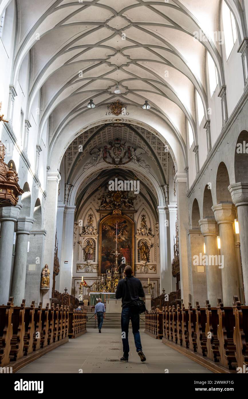 Description: Tourist views ceiling of the brightly lit Romanesque three ...