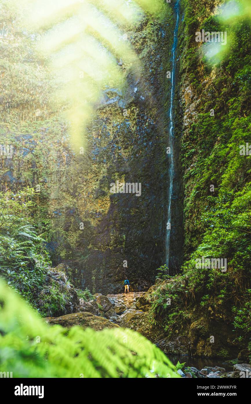 Description: Backpacker man in the distance looking at scenic ...