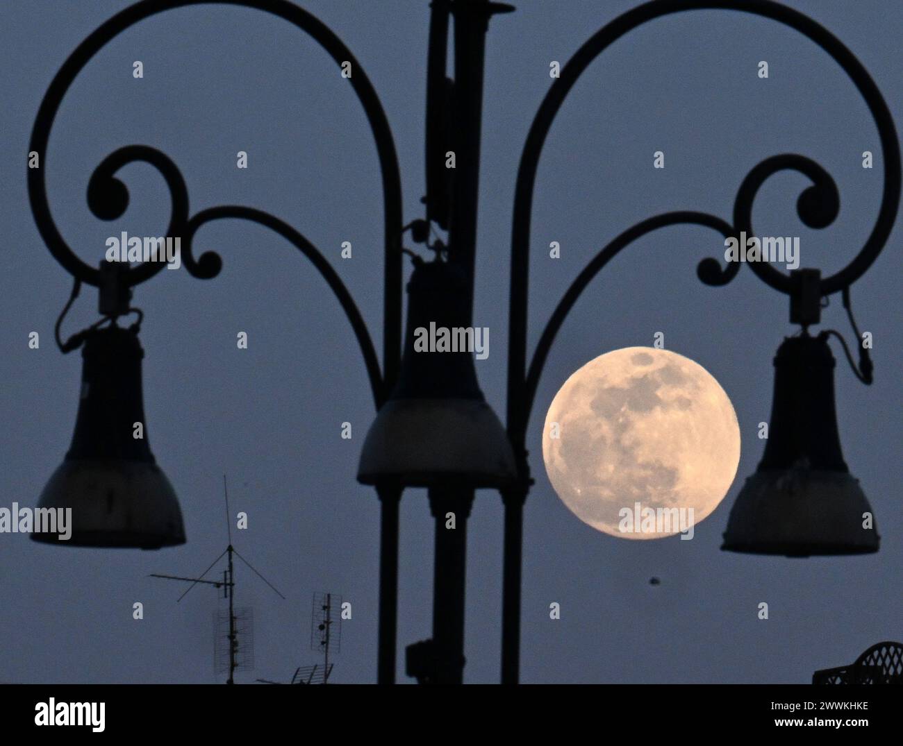 Rome, Italy. 24th Mar, 2024. The full moon is seen at Fori Imperiali of ...