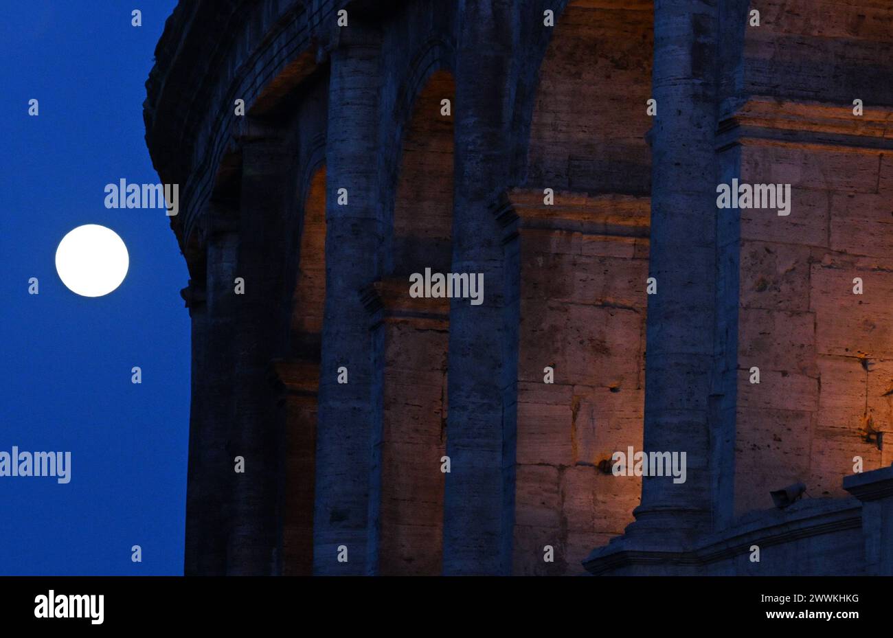 Rome, Italy. 24th Mar, 2024. The full moon is seen at the Colosseum of ...