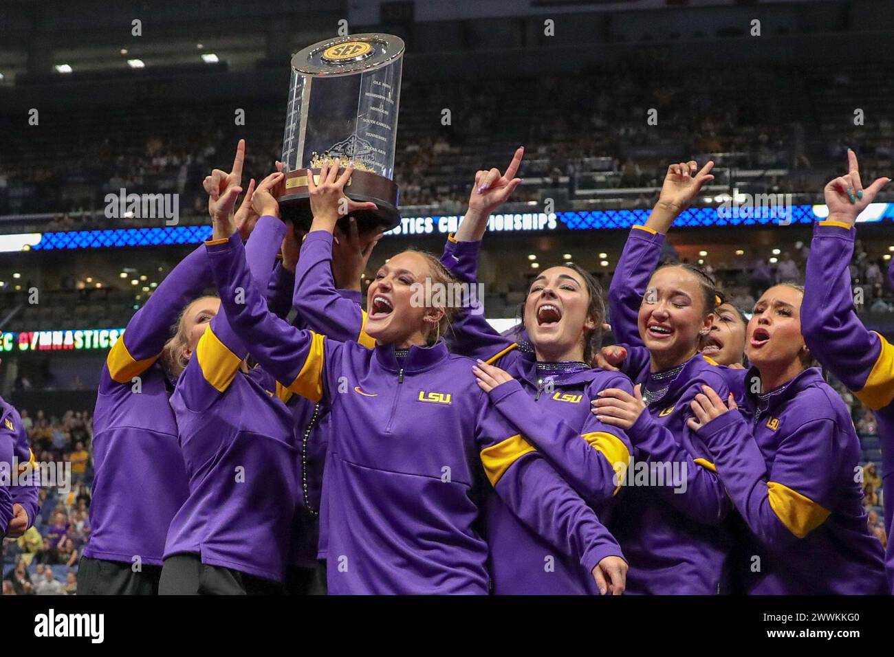 New Orleans, LA, USA. 23rd Mar, 2024. The LSU gymnastics team holds up ...