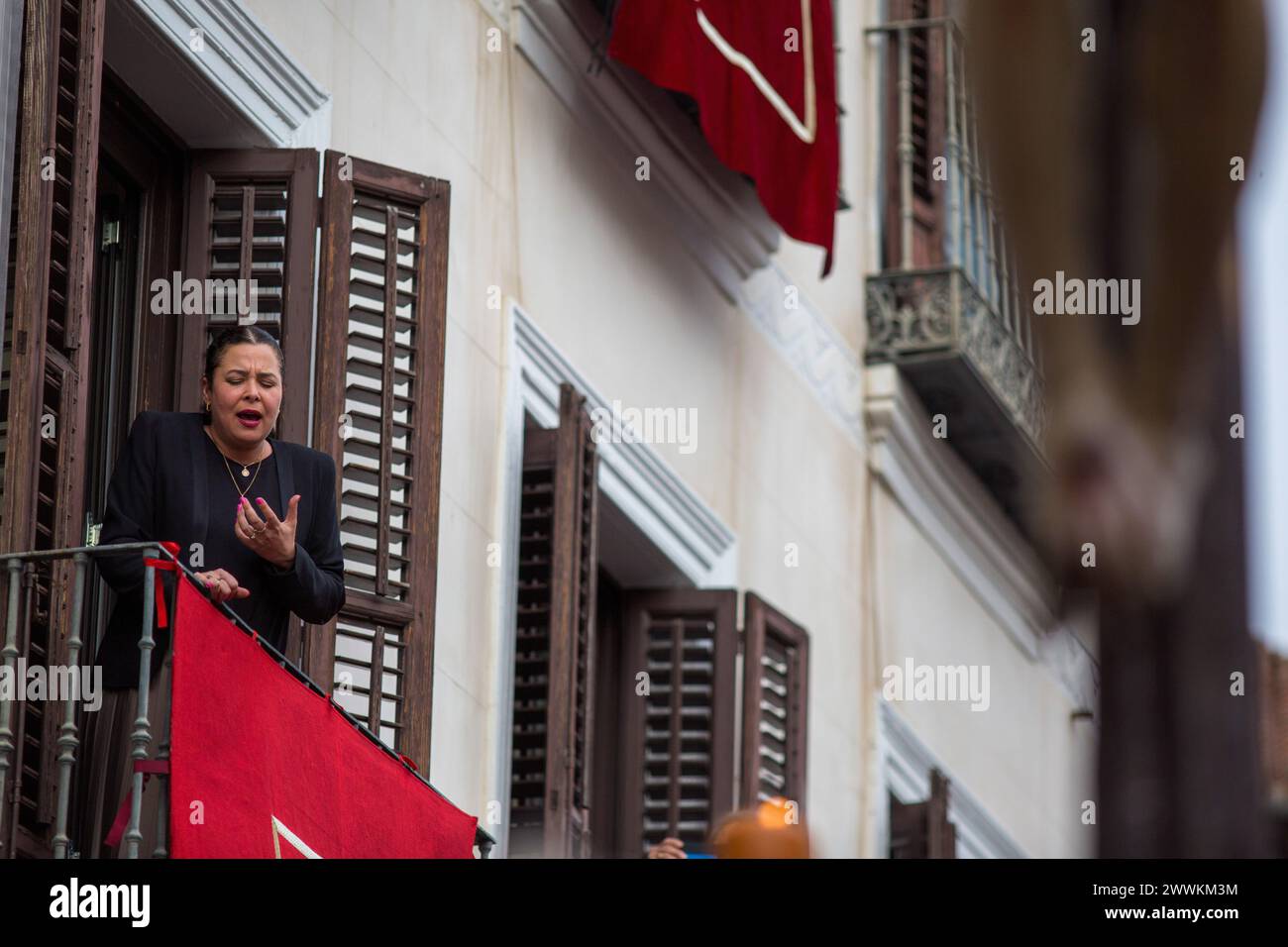 Madrid, Spain. 24th Mar, 2024. A woman sings from her balcony, during ...