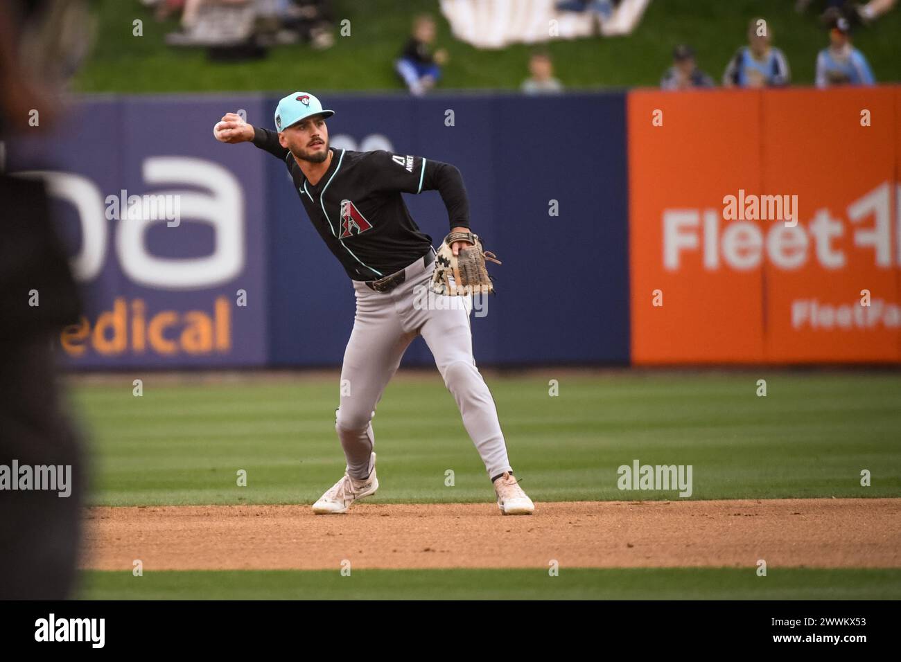 Arizona Diamondbacks second baseman Blaze Alexander (62) throws the ball to first base in the ...