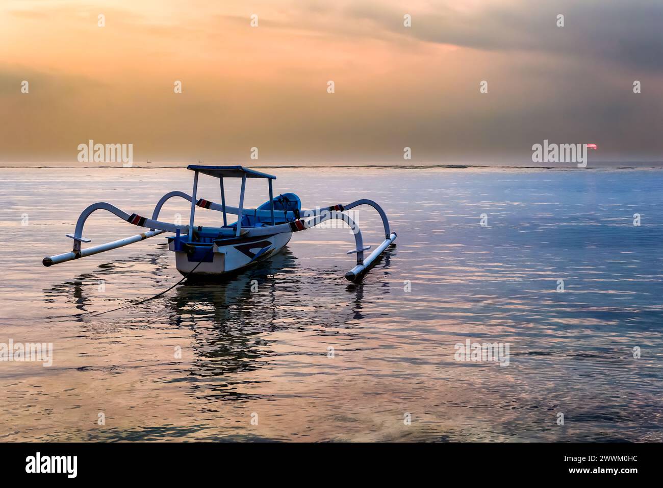 Traditional wooden boats on a tropical beach at sunset Stock Photo - Alamy