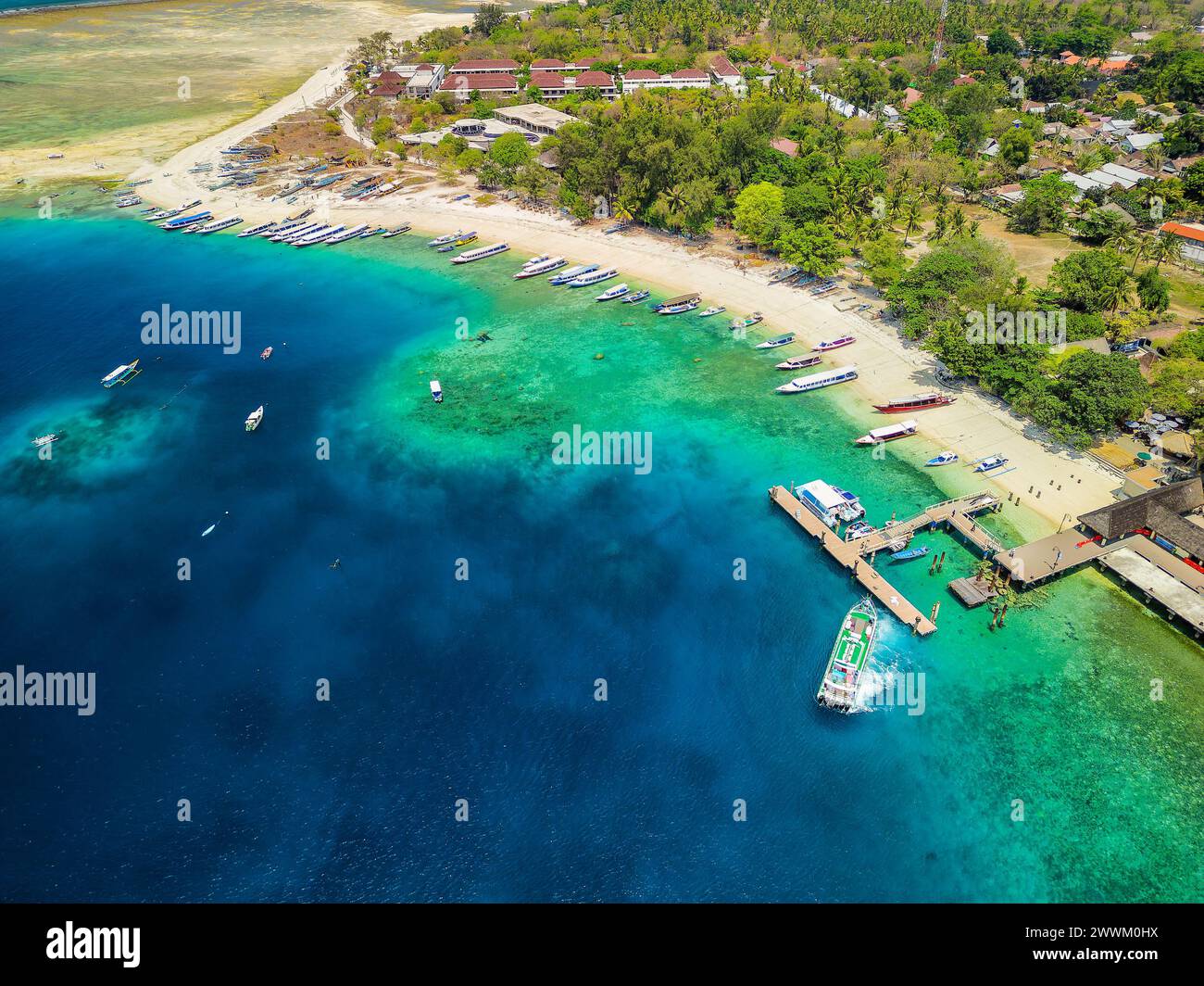 Boats surrounding a coral reef and small tropical island Stock Photo ...