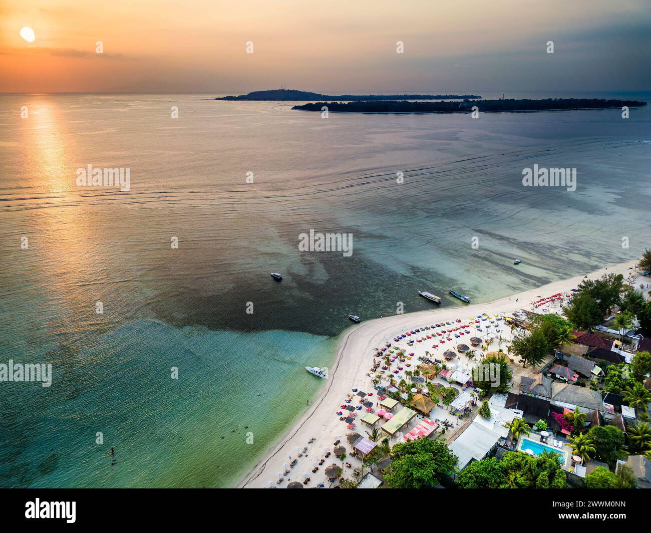 Aerial view of a beautiful tropical sunset and sandy beach (Gili ...