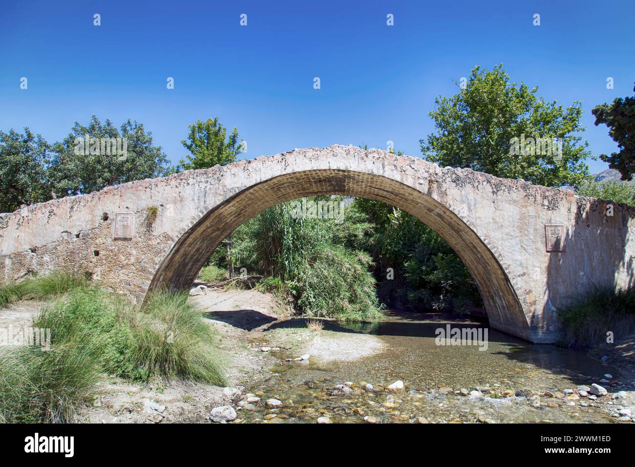 Stone bridge over the River Platis Potamos on the island of Crete ...