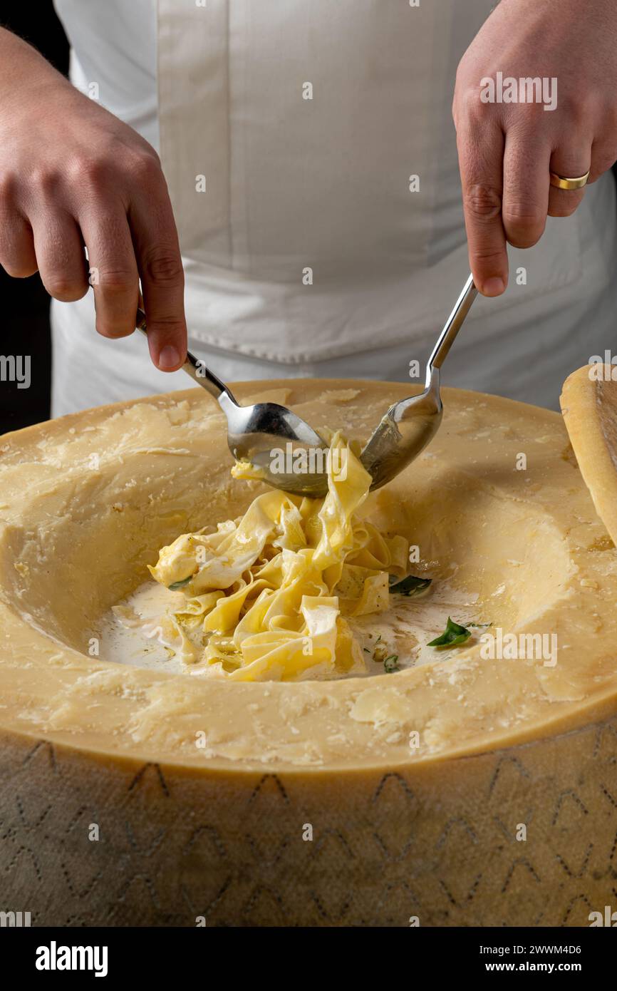 Fresh pasta with sauce in a whole parmesan wheel Stock Photo - Alamy