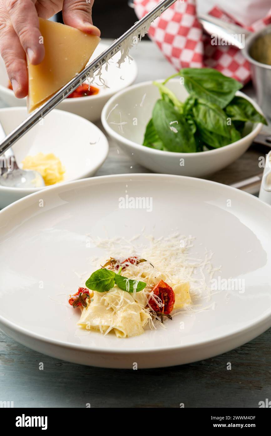 Fresh pasta with sauce in a whole parmesan wheel Stock Photo - Alamy