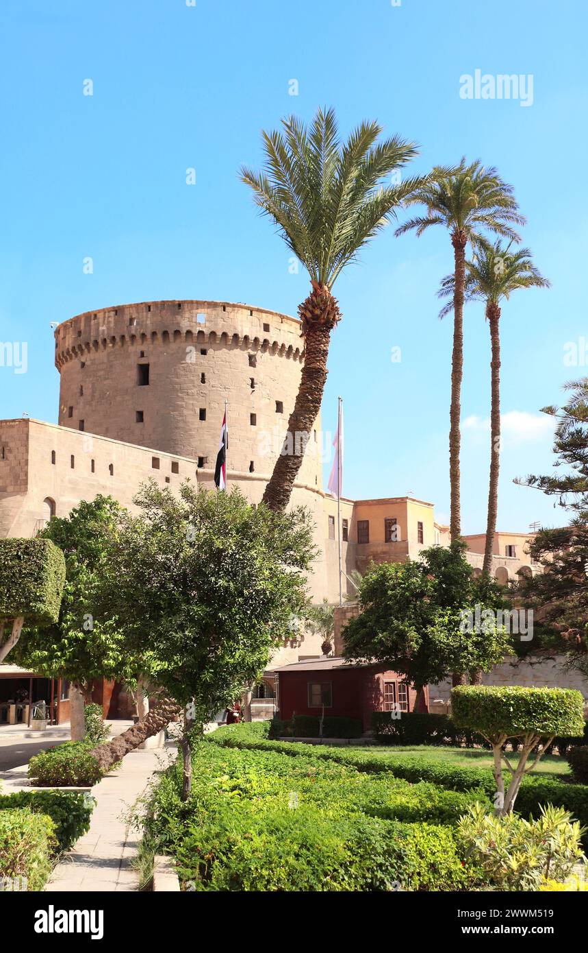 Watch tower, fortress wall and palm trees in ancient Cairo Citadel ...