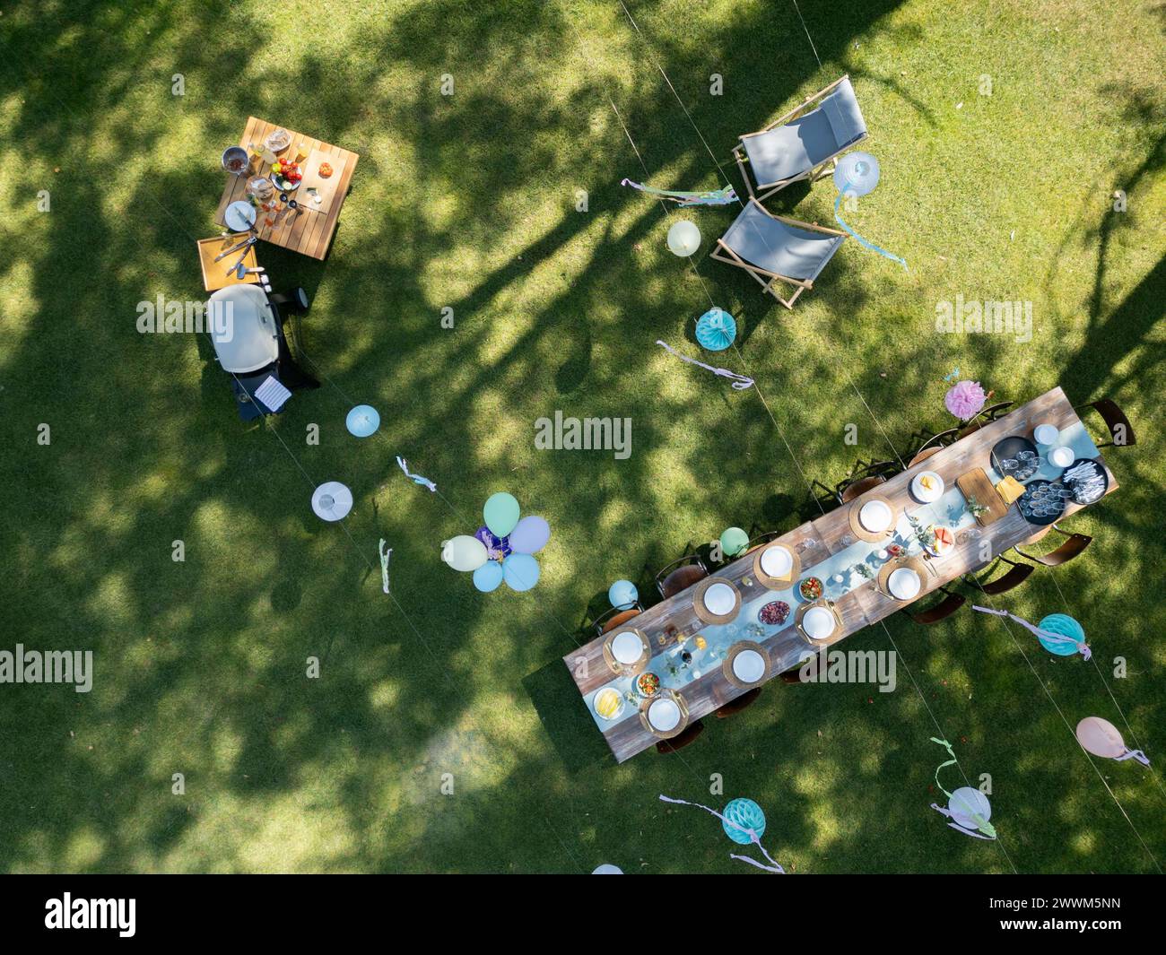 Top view of summer garden party in a beautiful garden. BBQ family ...
