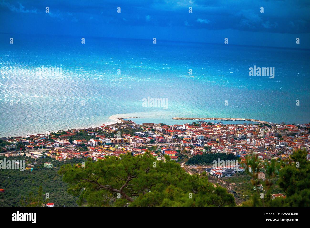 A serene coastal town, where charming houses line the beach and a ...