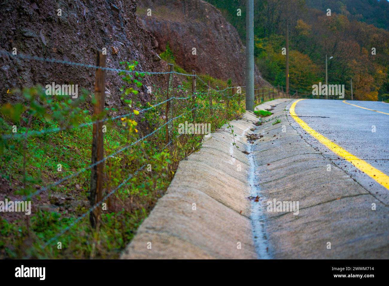 Detailed asphalt road profile: A closeup view showcasing the texture ...