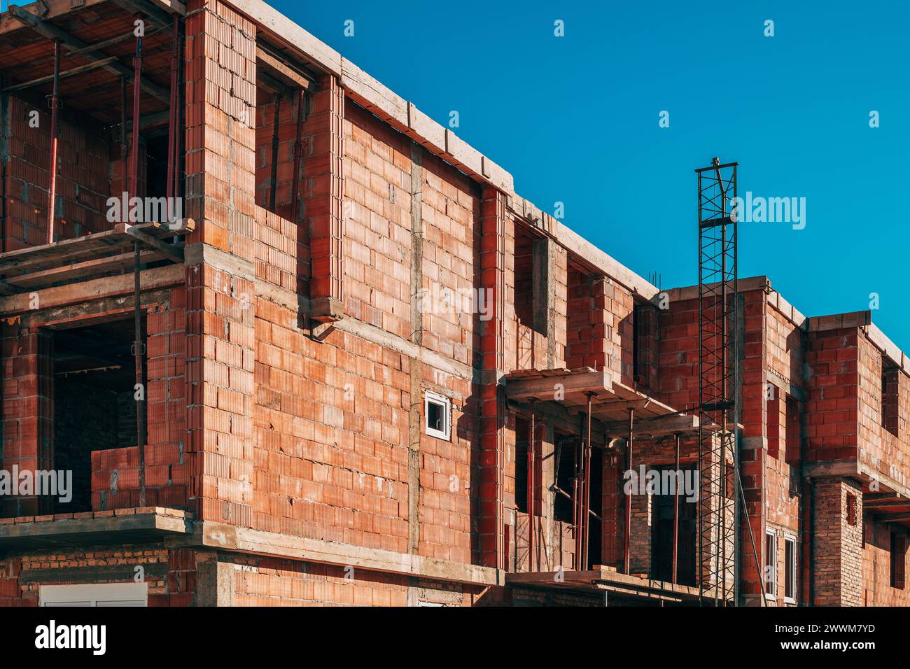 Construction site, building large two story residential house, against ...