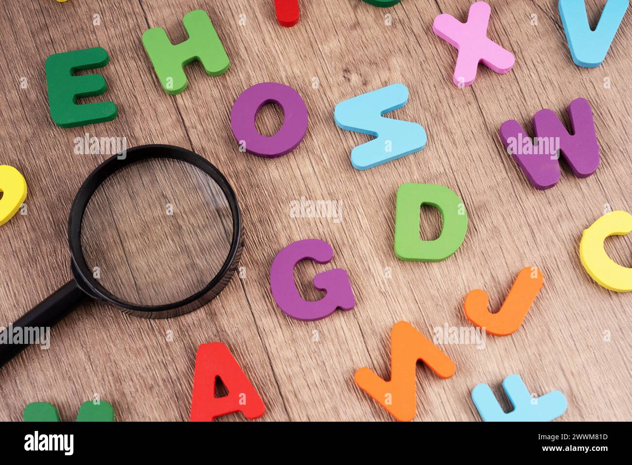 Alphabet with a magnifying glasses Stock Photo - Alamy