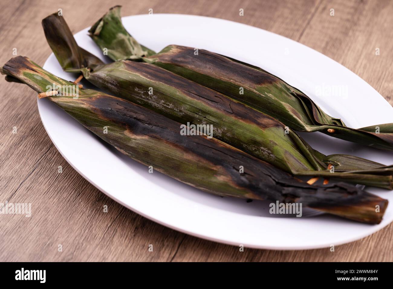 Close up of Pulut Panggang or grilled glutinous rice Stock Photo - Alamy