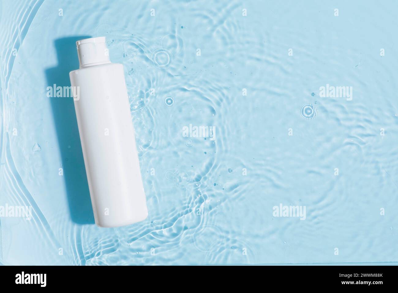 Cosmetic moisturizer with hyaluronic acid, micellar emulsion on blue ...