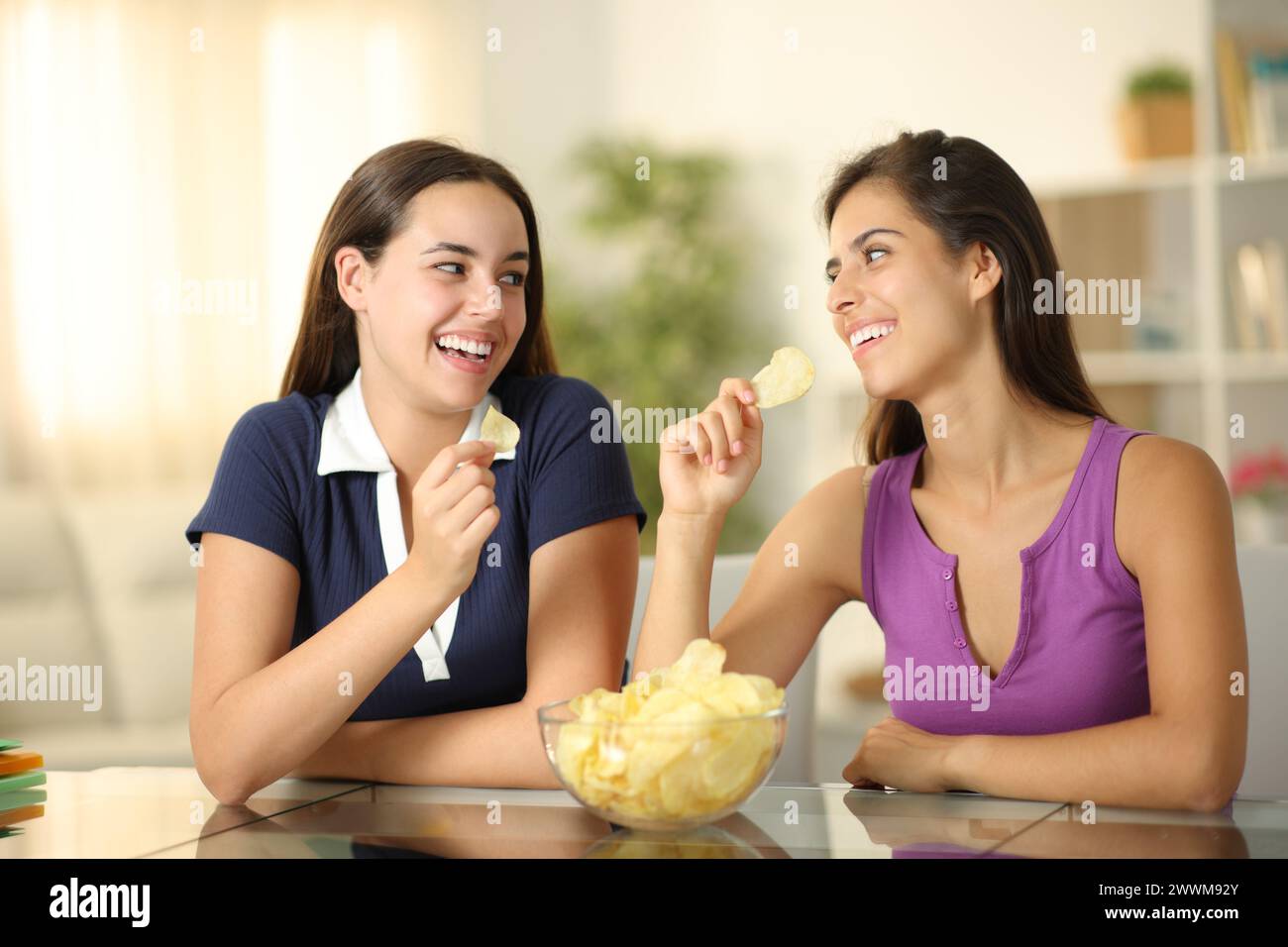 Fat person eating chips hi-res stock photography and images - Alamy
