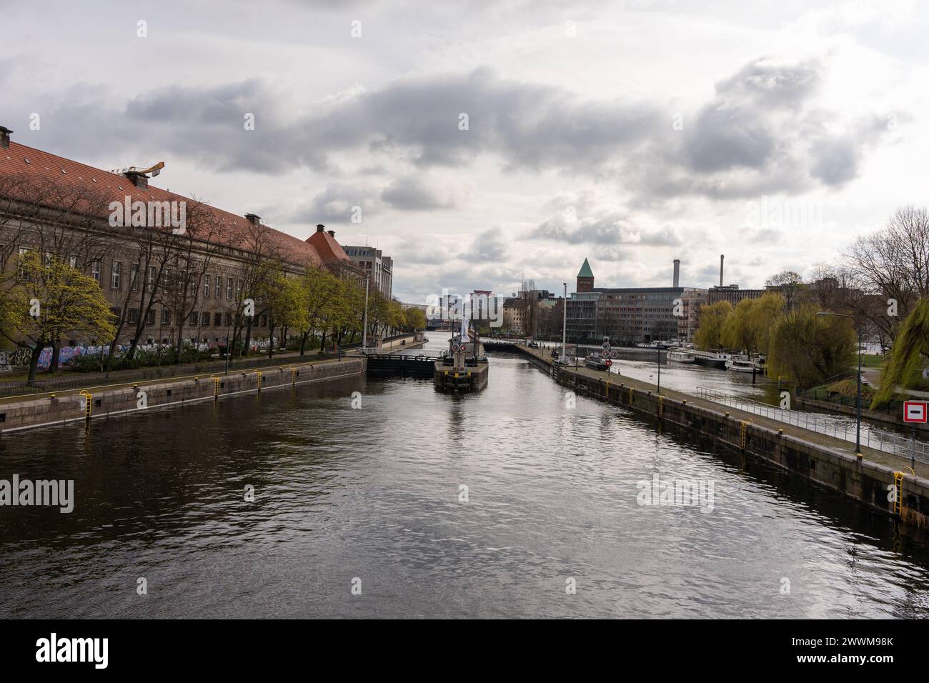 The river flows along the ancient houses of the European city of Berlin ...