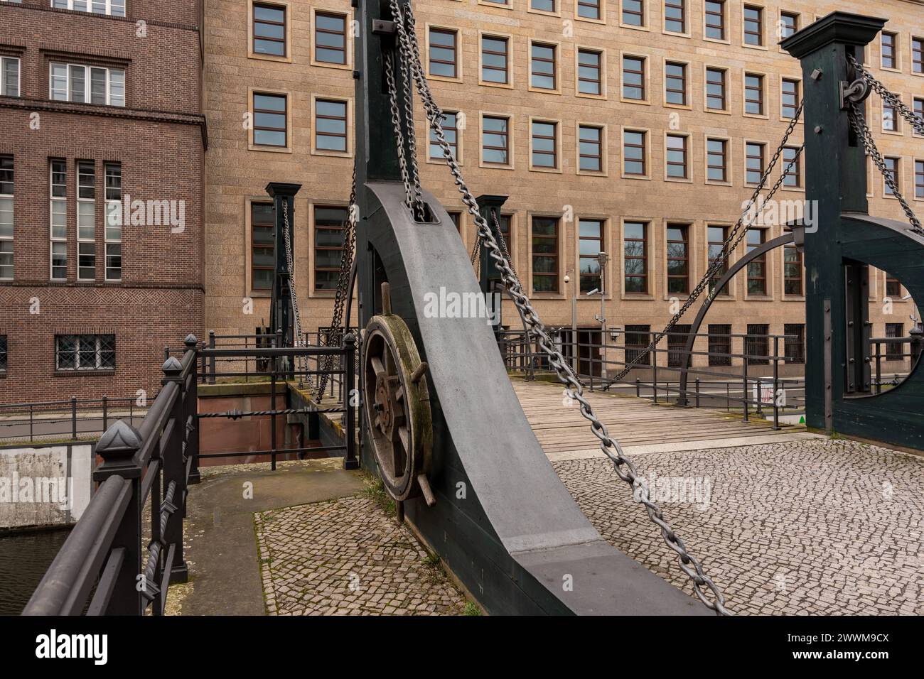 An ancient drawbridge across the river in Berlin. Close-up of the old ...