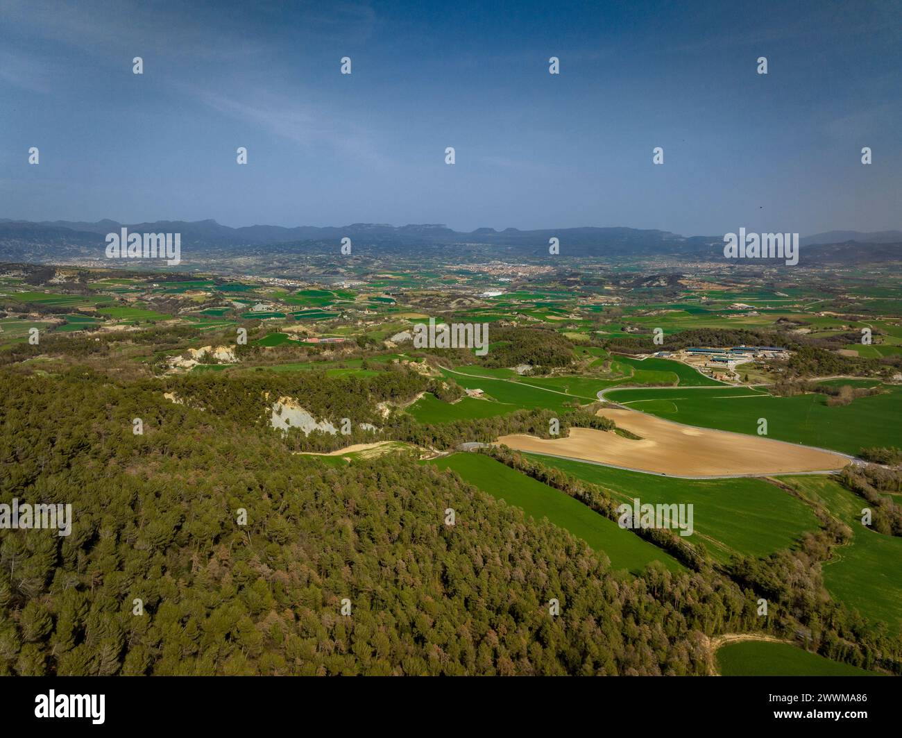 Aerial view of the green Plana de Vic in spring with haze and poor ...