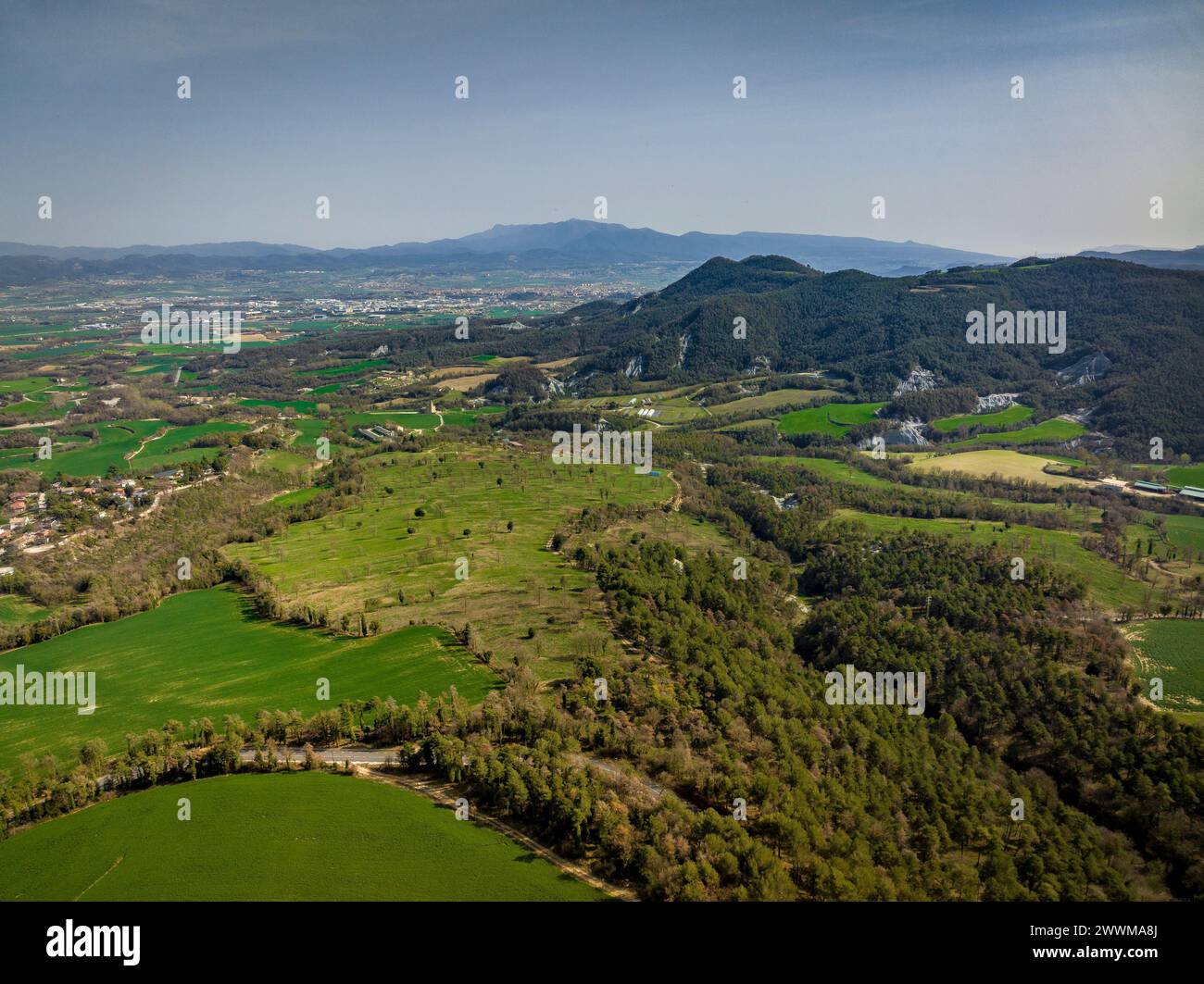 Aerial view of the green Plana de Vic in spring with haze and poor ...