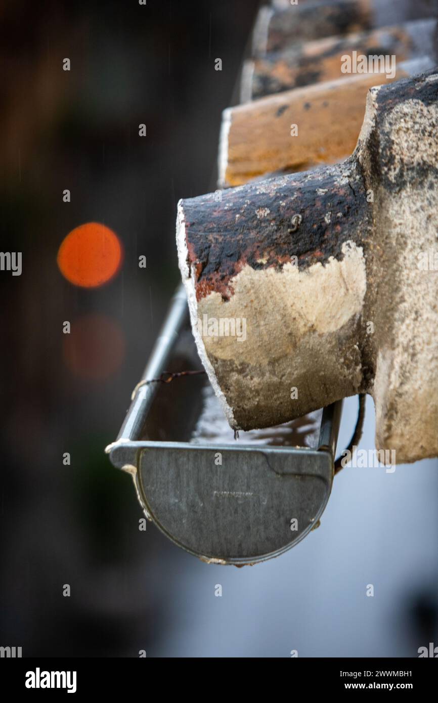 Detail of a roof with a gutter for rainwater Stock Photo - Alamy