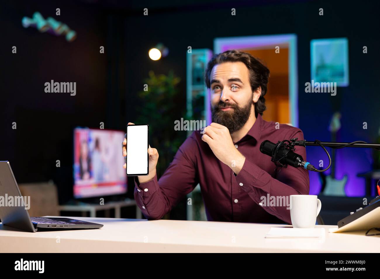 Content creator reviewing mockup mobile phone received from sponsor ...