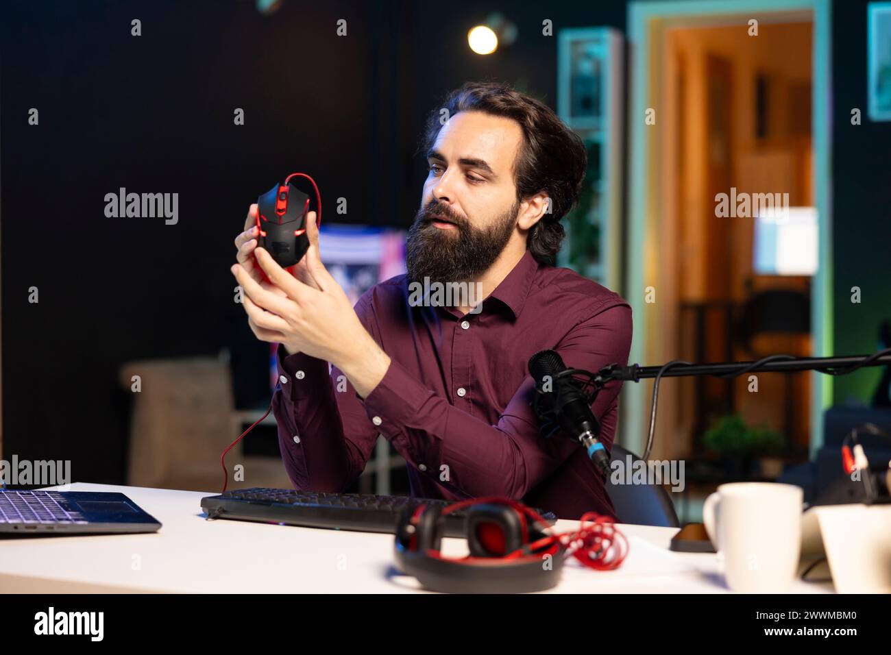Tech guru filming technology review of wireless gaming mouse for ...