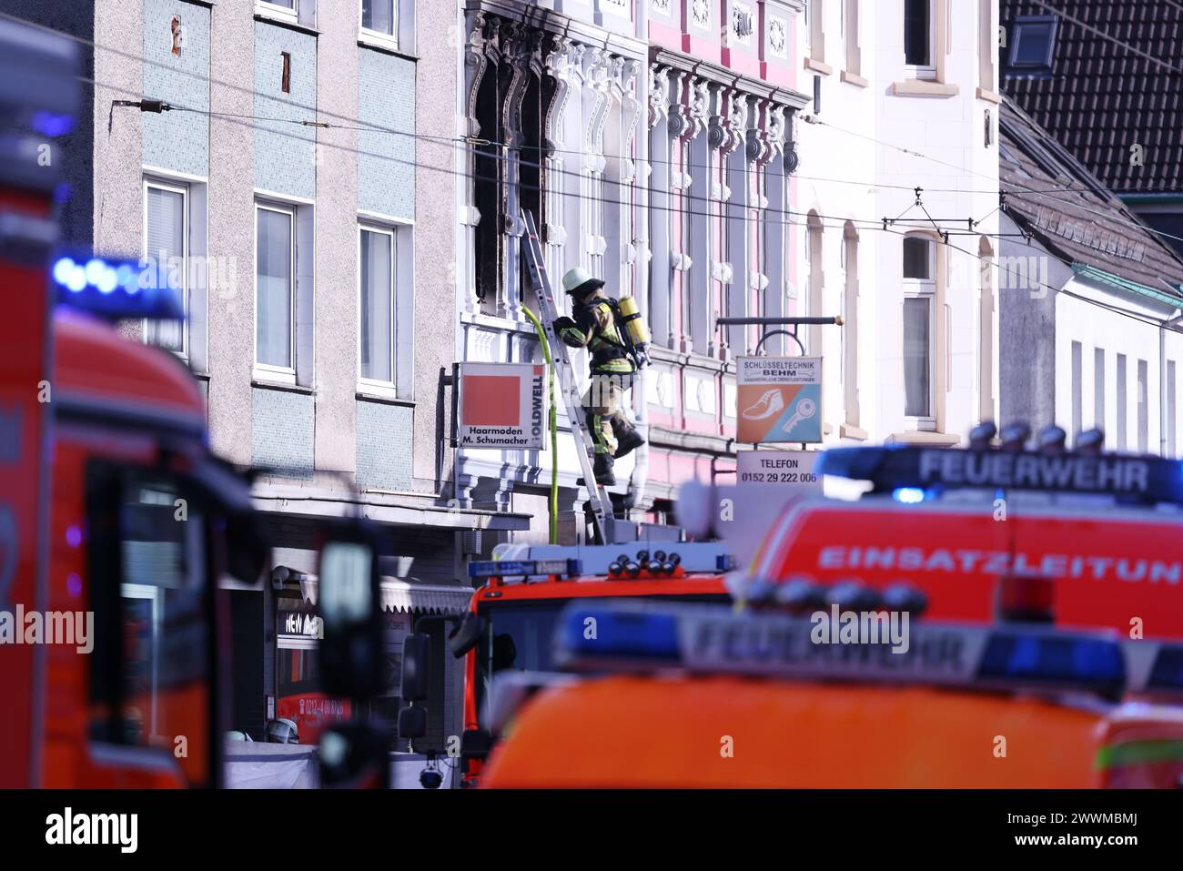 Solingen, Germany. 25th Mar, 2024. A firefighter climbs a ladder at a ...