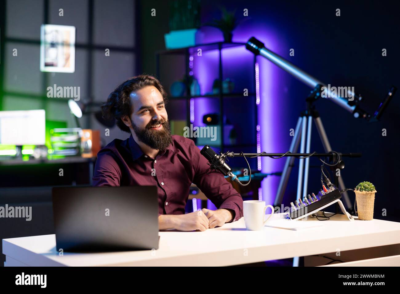 Happy internet star using quality mic in studio to discussing with ...