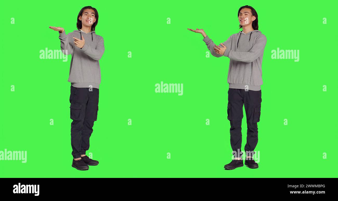 Asian person illustrating marketing ad over full body greenscreen ...