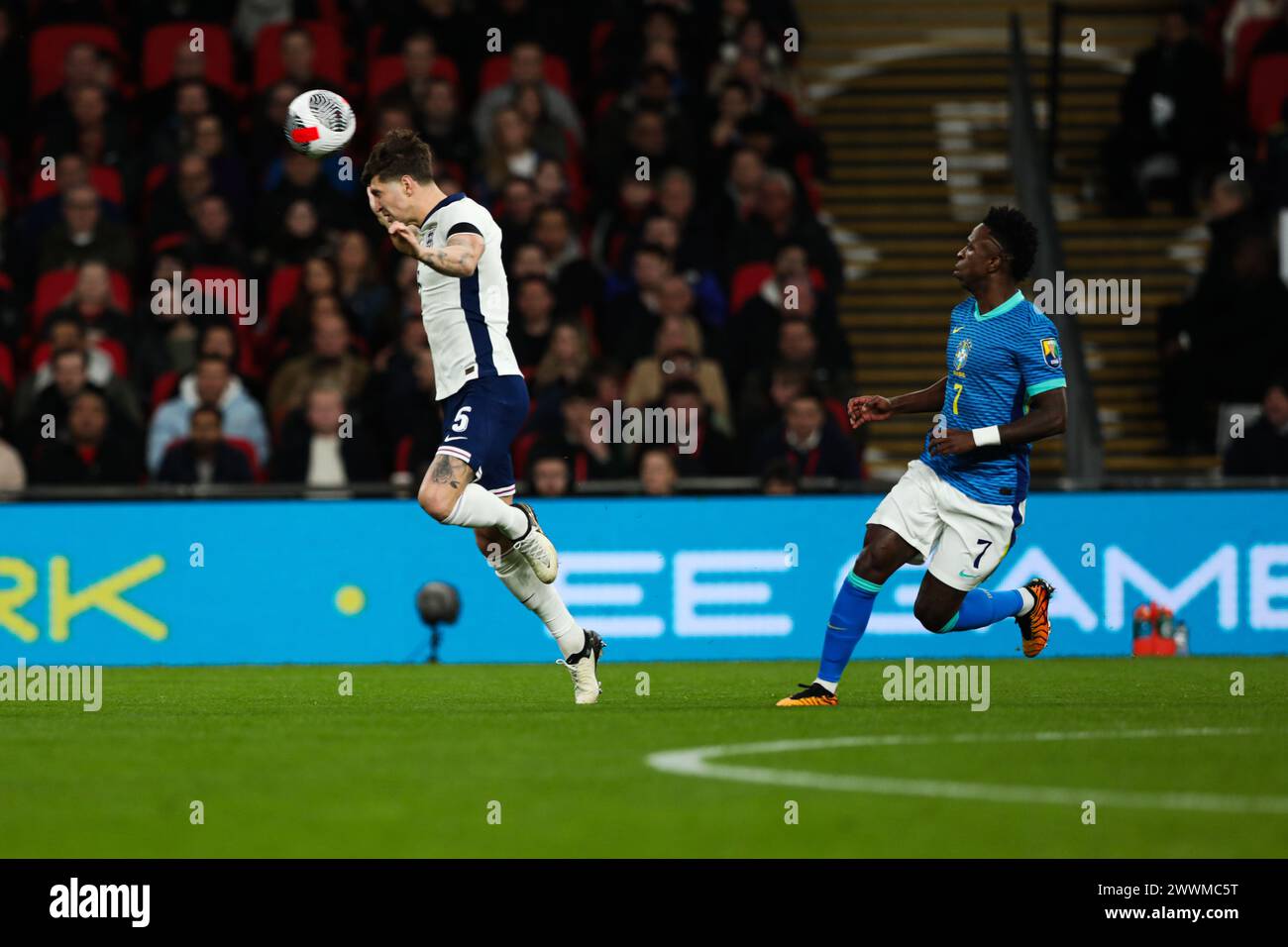 John Stones of England heading ball watched by Vinicius Junior of ...