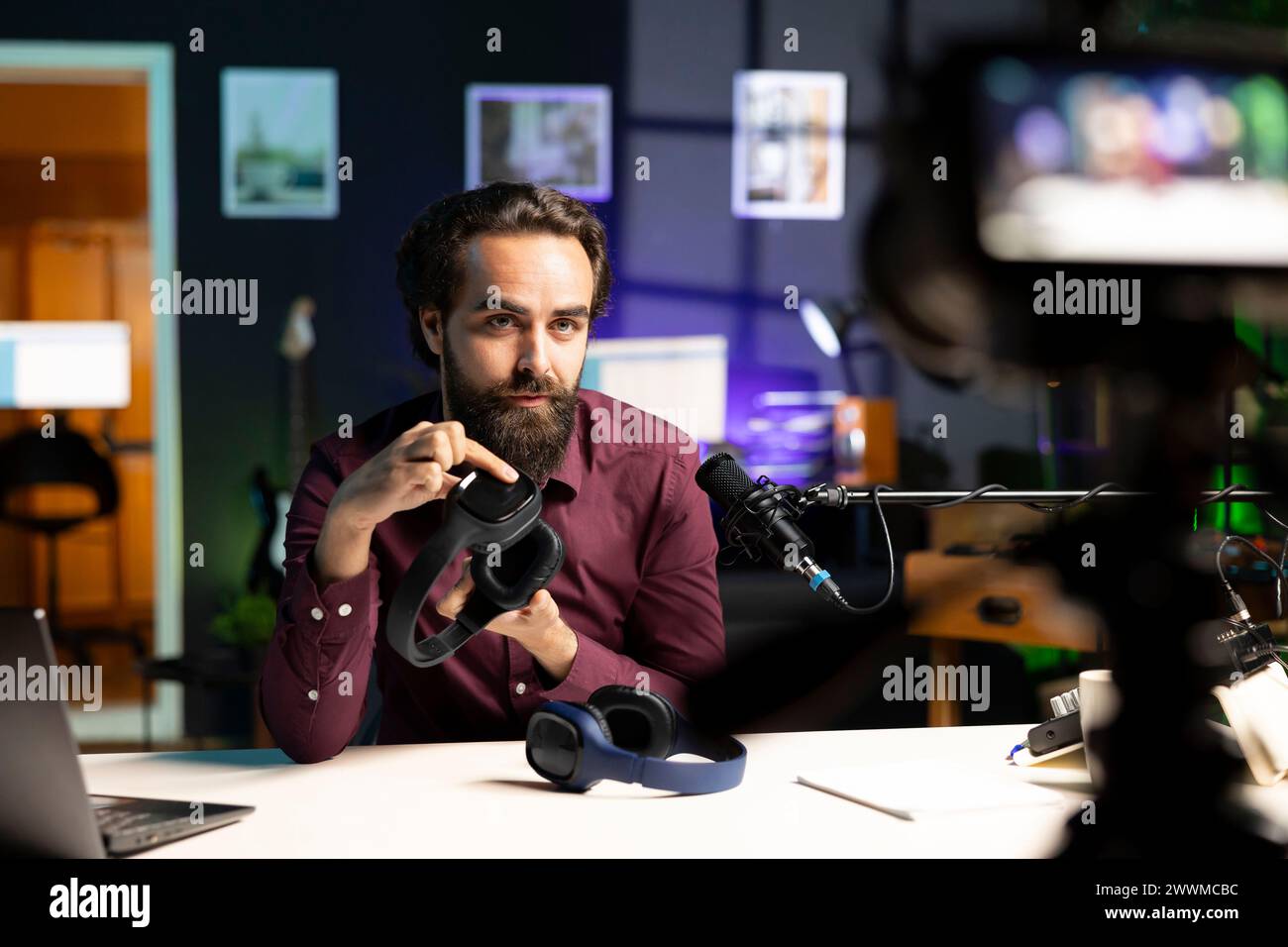 Audiophile reviewing newly launched wireless headphones, testing sound ...