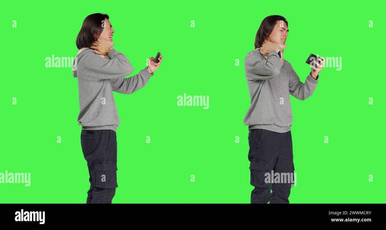 Asian man filming video on phone, wearing cervical neck brace over ...