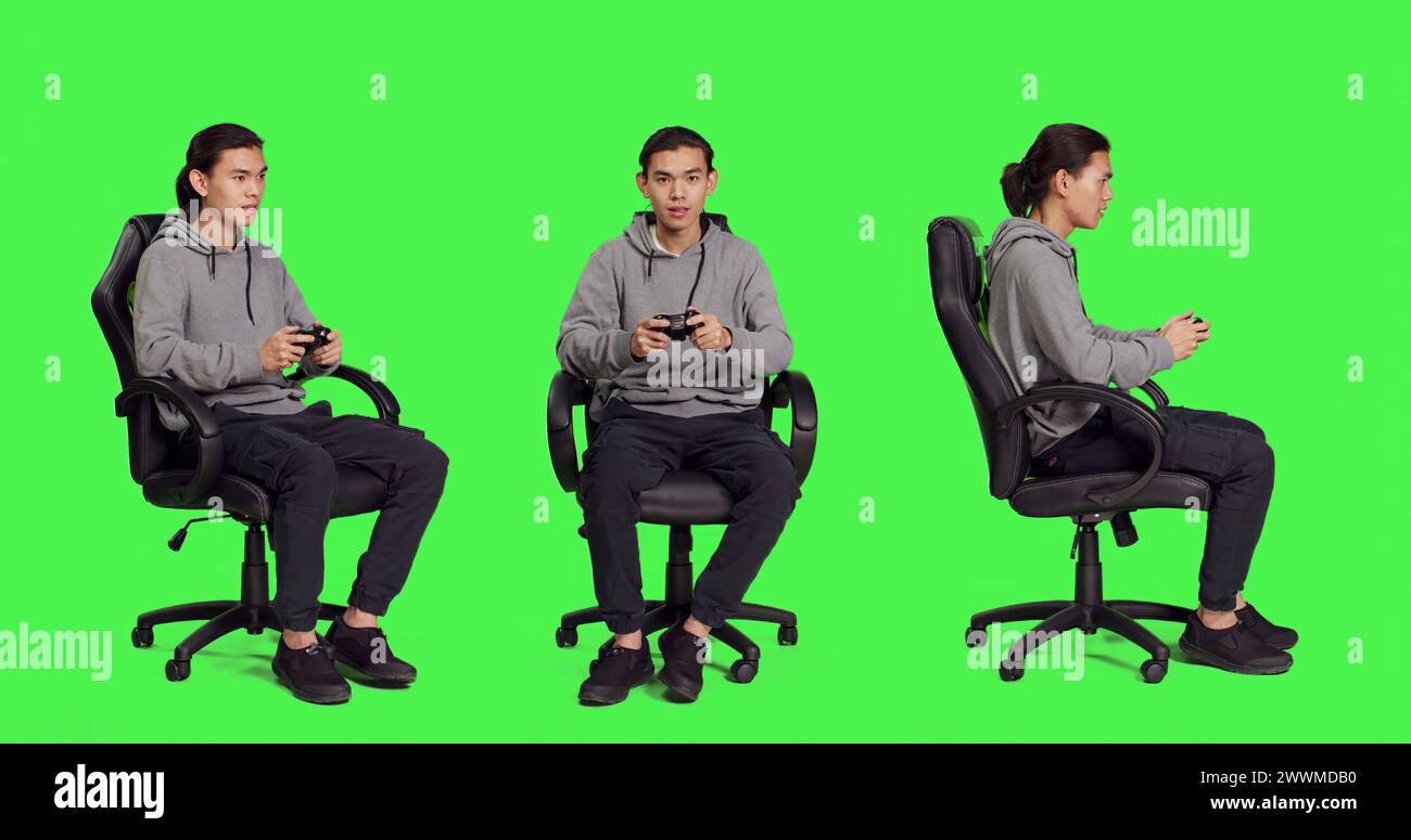 Young gamer playing videogames over full body greenscreen template ...