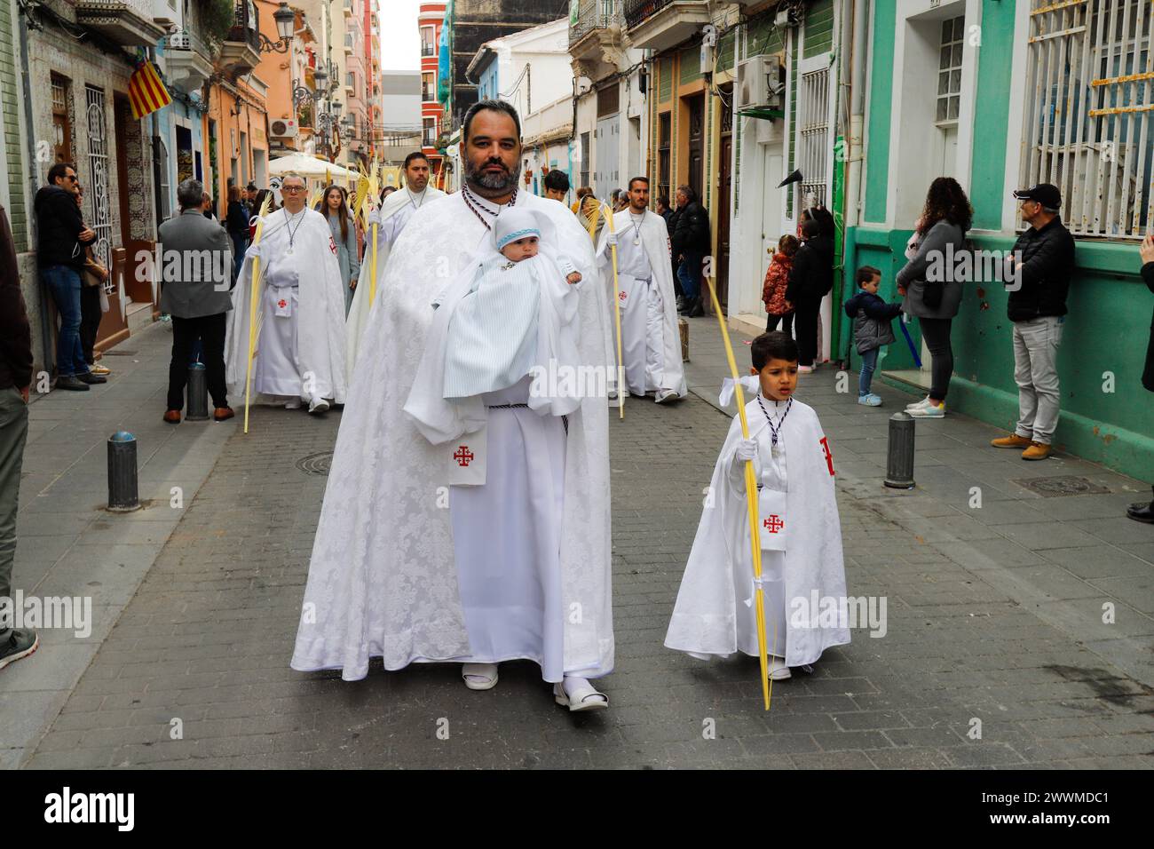 Penitents during a Holy week parade at Cabanyal quarter in Valencia ...