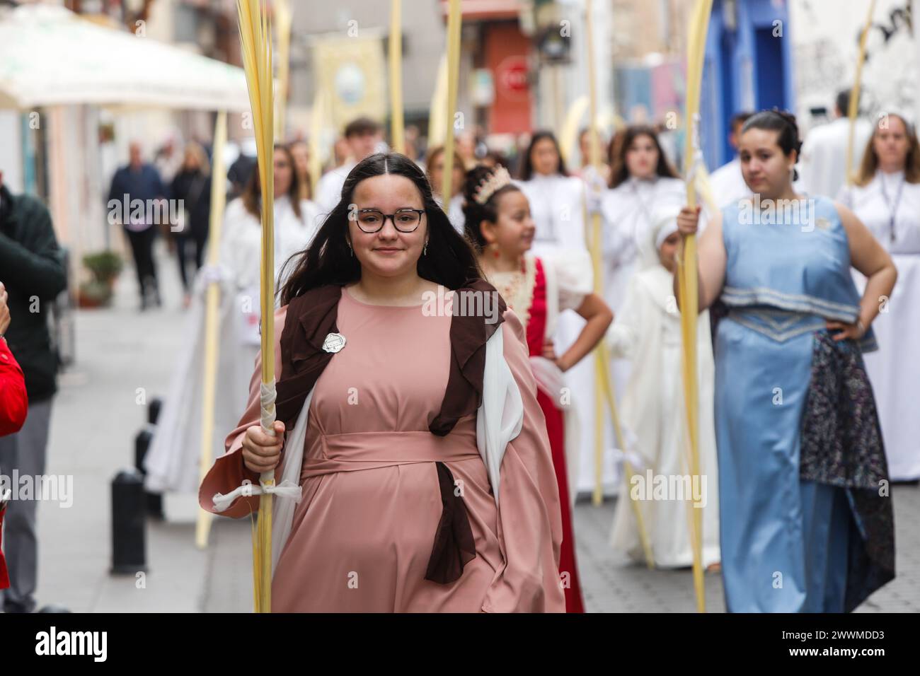 Penitents during a Holy week parade at Cabanyal quarter in Valencia ...