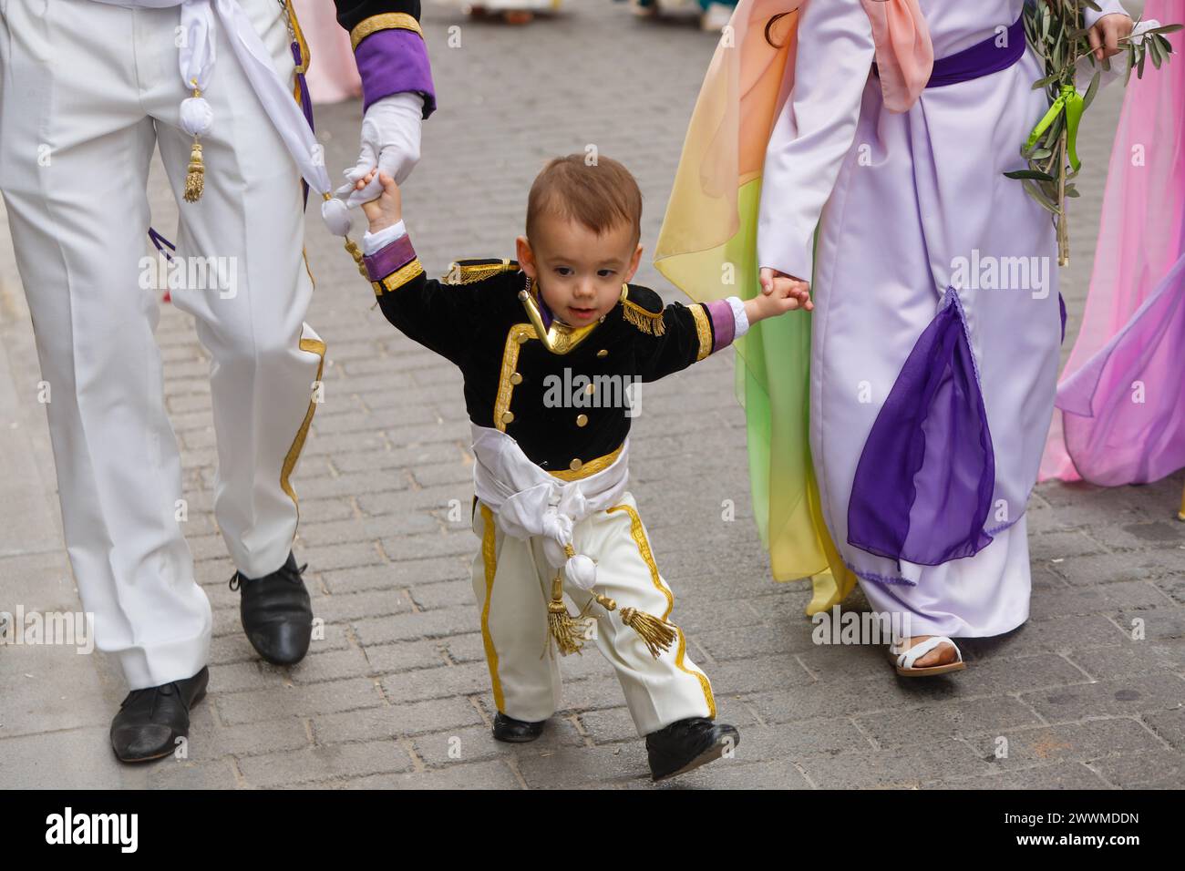 Penitents during a Holy week parade at Cabanyal quarter in Valencia ...