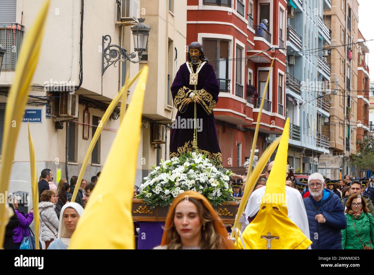 Penitents during a Holy week parade at Cabanyal quarter in Valencia ...