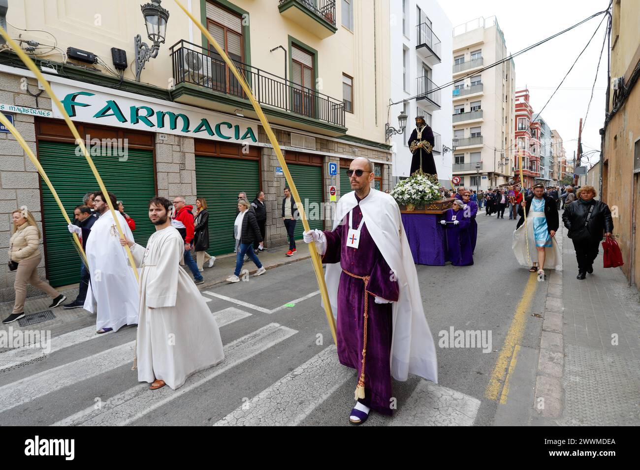 Penitents during a Holy week parade at Cabanyal quarter in Valencia ...