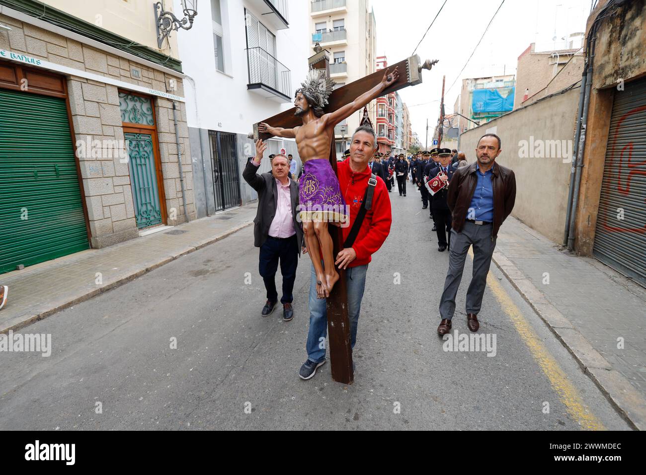 Penitents during a Holy week parade at Cabanyal quarter in Valencia ...